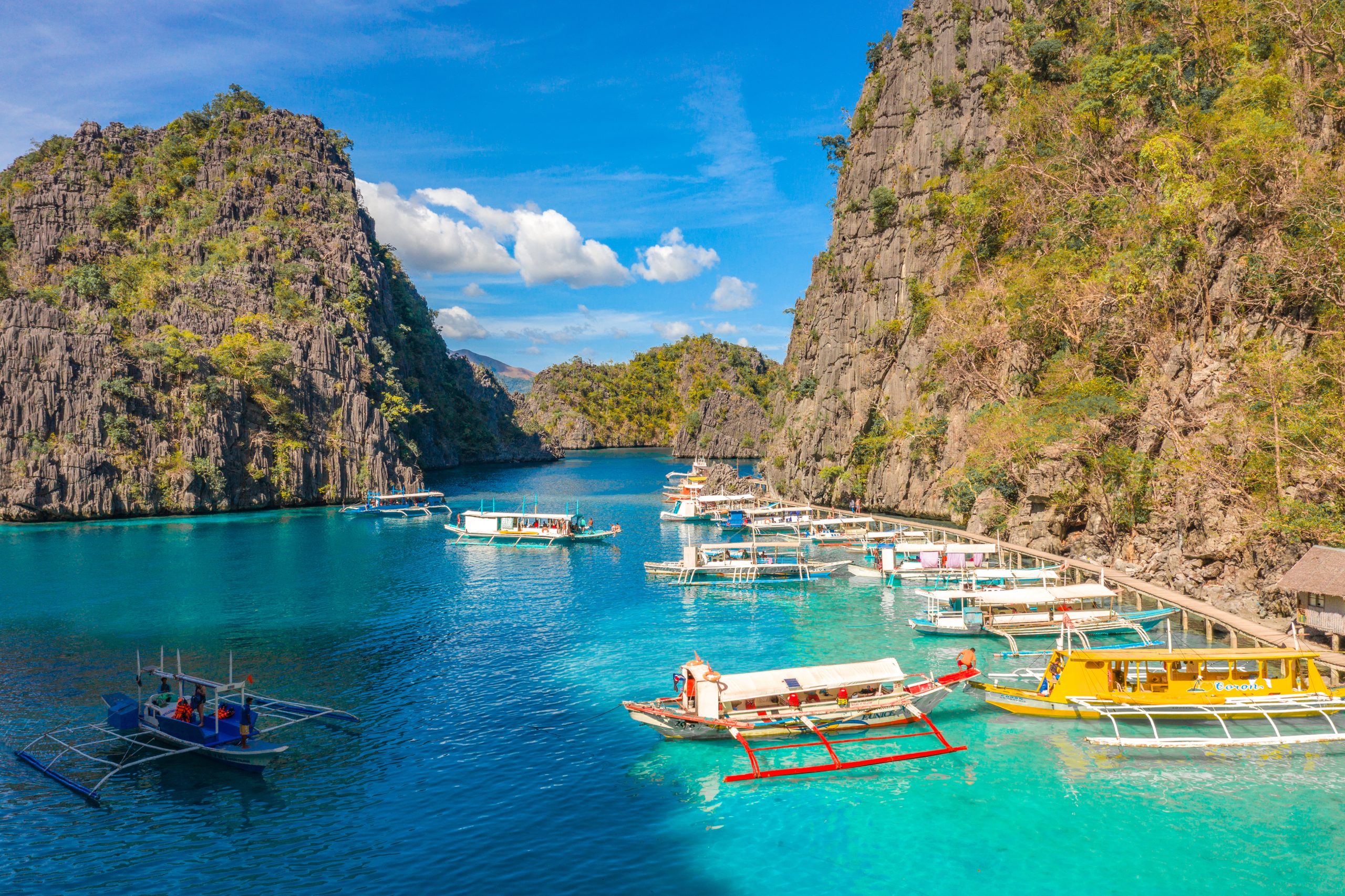 Tour boats by the shore at Coron island Philippines Fishermen boats by ...